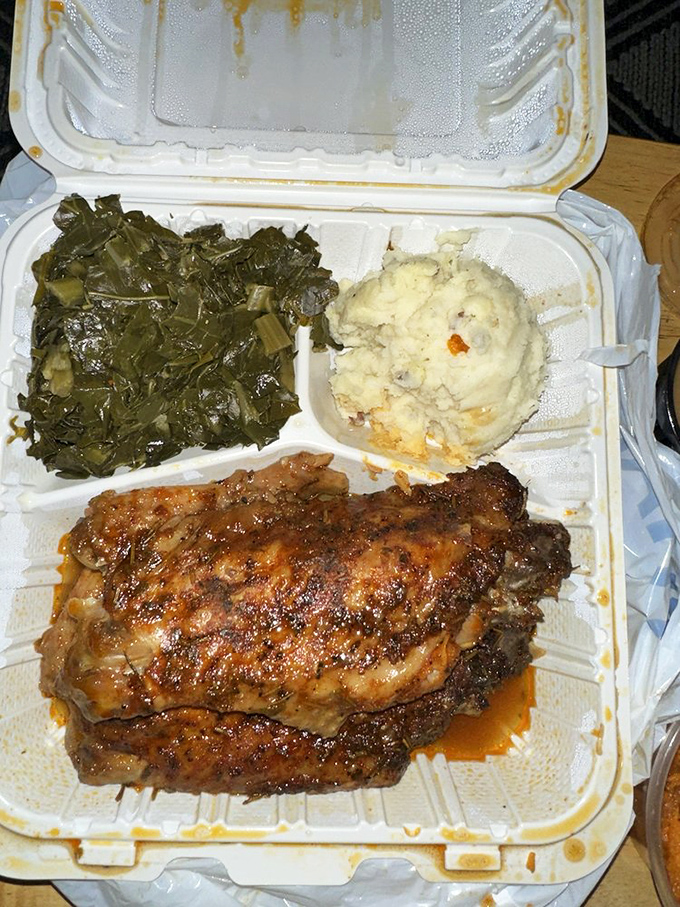 Smothered turkey wings lounging in gravy next to mashed potatoes and greens. This isn't just dinner&mdash;it's an edible hug.