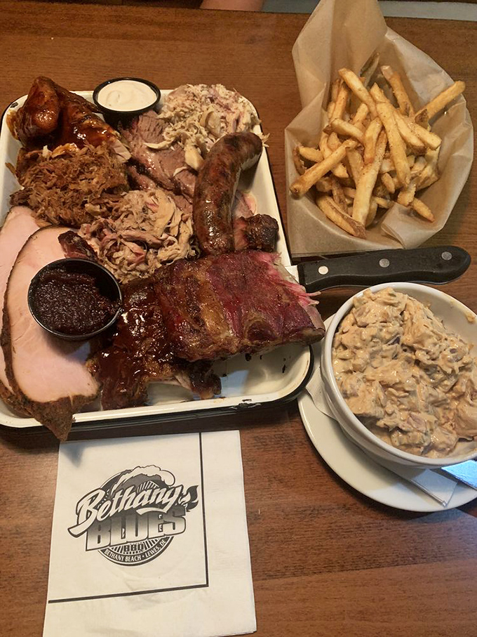 The Ultimate BBQ Sampler: where decisions are unnecessary and gluttony is encouraged&mdash;a meat lover's dream team assembled on a single glorious plate.