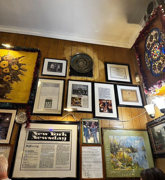 The wall of fame tells stories more authentic than any Instagram feed&mdash;framed memories and newspaper clippings forming a culinary time capsule of Brooklyn history.