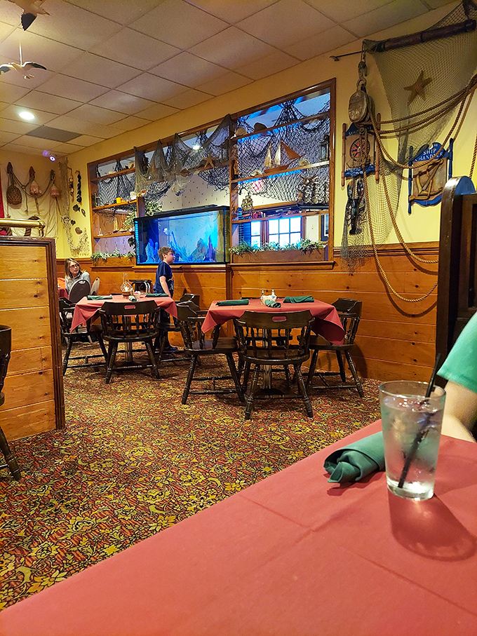 Fishing nets and nautical decor transform this dining room into a cozy captain's quarters where calories don't count and diets go to die.