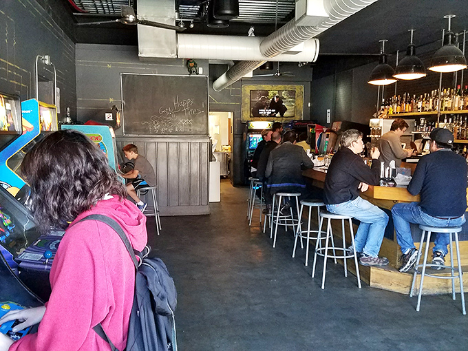 The bar's open layout invites both serious gamers and casual visitors to mingle in a space where nostalgia meets modern mixology.