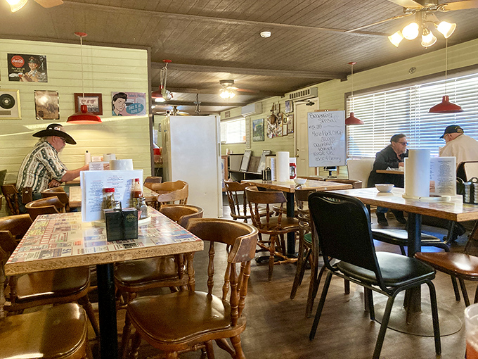 Morning light streams through the blinds, illuminating wooden tables where countless Arkansas mornings have begun with coffee and conversation.