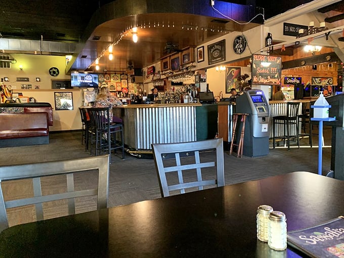 The bar area beckons with promises of craft beverages and lively conversation. Those hanging lights aren't just illuminating the space&mdash;they're spotlighting good times.