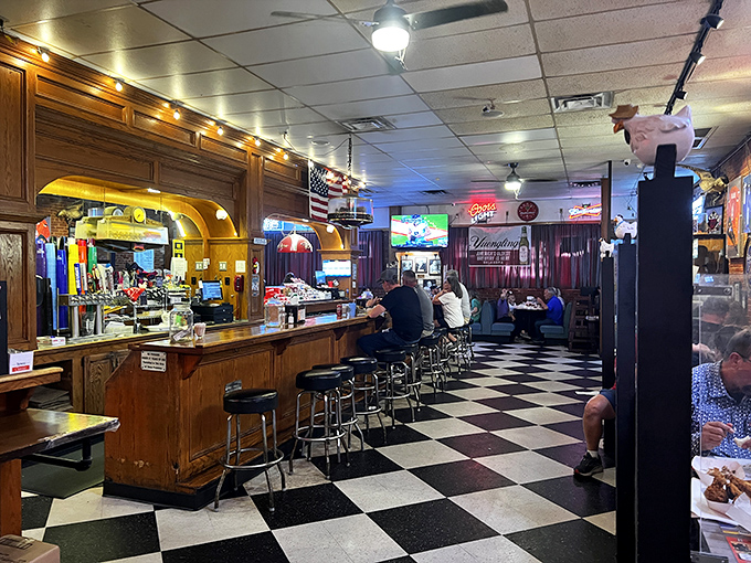 A bar that understands priorities: good lighting for the game, comfortable stools for the patrons, and quick access to legendary fried chicken.