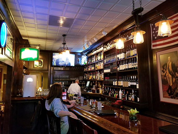 The bar area channels revolutionary spirit with colonial d&eacute;cor, an impressive wall of bottles, and the promise of libations worthy of a founding father's toast.