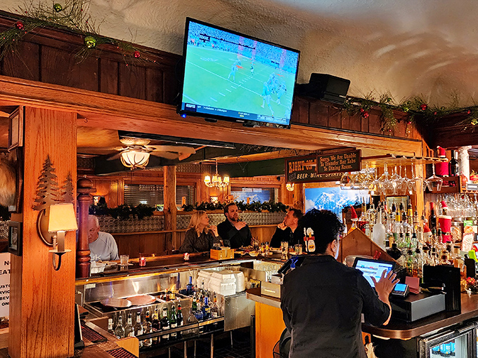 The bar where strangers become friends over bourbon discussions and the shared religion of good food.
