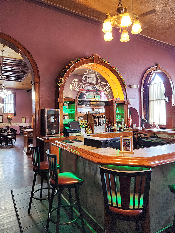 The bar area, with its curved wood and vintage charm, makes ordering a Manhattan feel like you're participating in a scene from Mad Men.