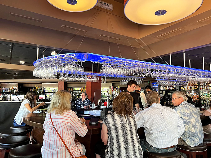 The bar at Chandlers doesn't just serve drinks &ndash; it creates liquid memories under a canopy of suspended glassware that catches light like crystal rain.