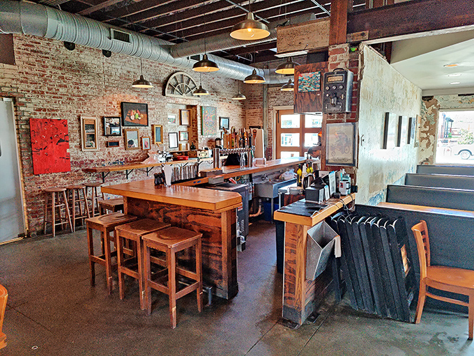 The bar area showcases exposed brick, warm wood, and the promise of local brews &ndash; a gathering spot where strangers become friends over shared plates.