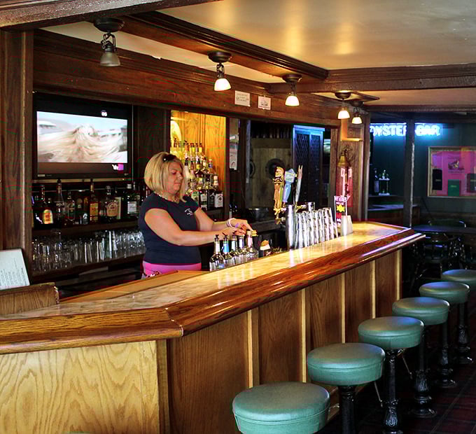 The bar: where stories flow as freely as the drinks, and locals share their secret fishing spots only after their second cold one.