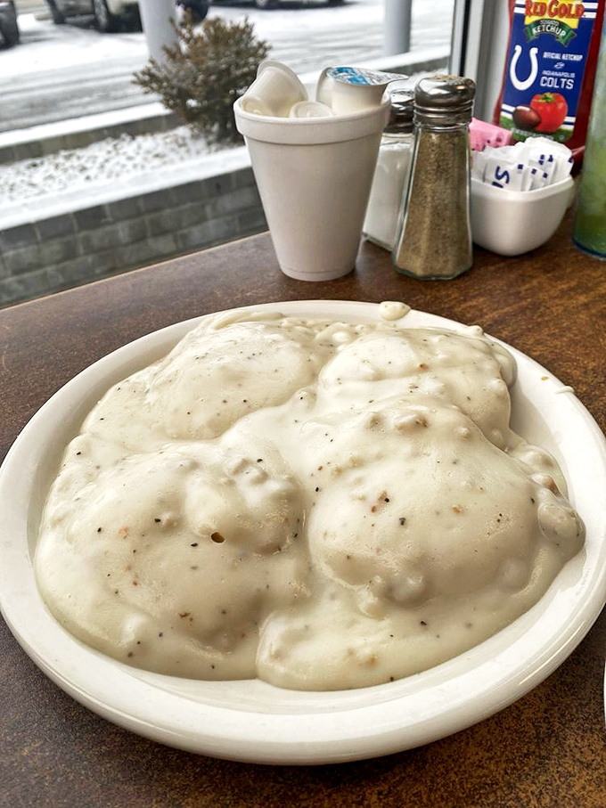 These biscuits and gravy look like clouds floating in a savory heaven&mdash;a plate that hugs you from the inside out.