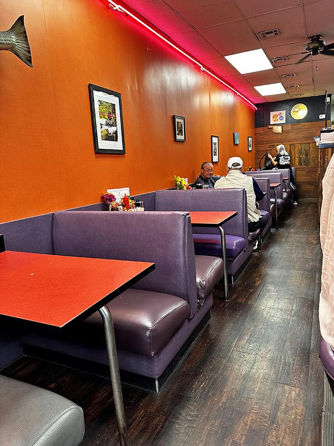 Purple booths and orange walls&mdash;a color combo that shouldn't work but somehow feels like breakfast's natural habitat in this narrow slice of paradise.