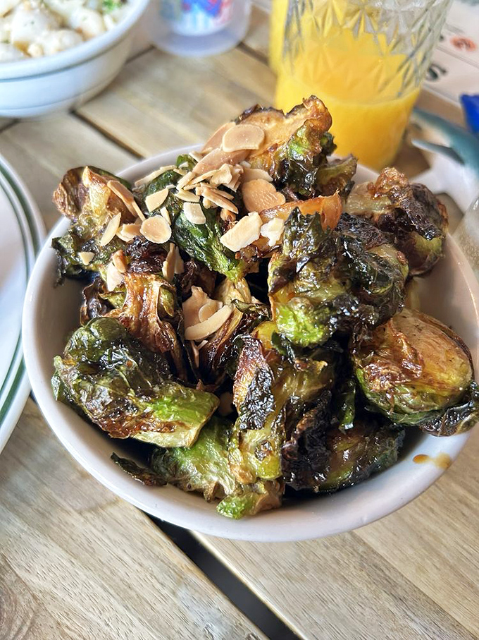 Brussels sprouts so caramelized and topped with crunchy almonds, they've converted more vegetable skeptics than all the health magazines combined.