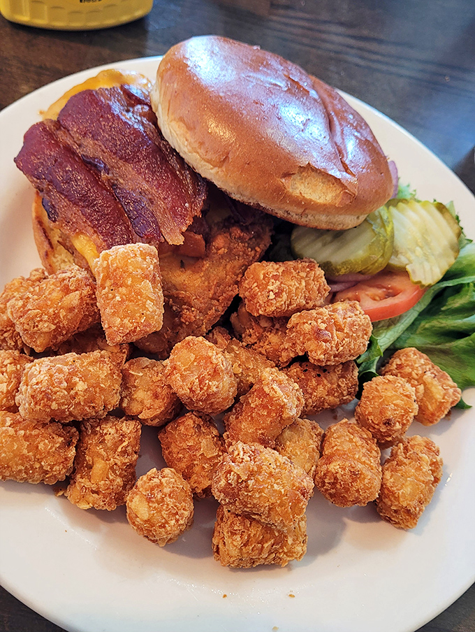 This isn't just a burger—it's a tower of tater tots, bacon, and beef that makes you grateful for elastic waistbands and afternoon naps.