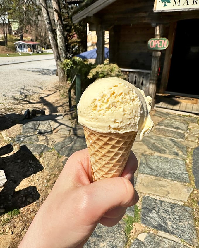 Ice cream cones taste better against a backdrop of history. This butter pecan scoop is living its best life outside a store older than your grandparents.