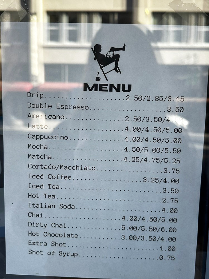 The caf&eacute; menu featuring the silhouette of a reader in repose. Coffee prices that won't make you choose between your caffeine fix and your next literary fix.