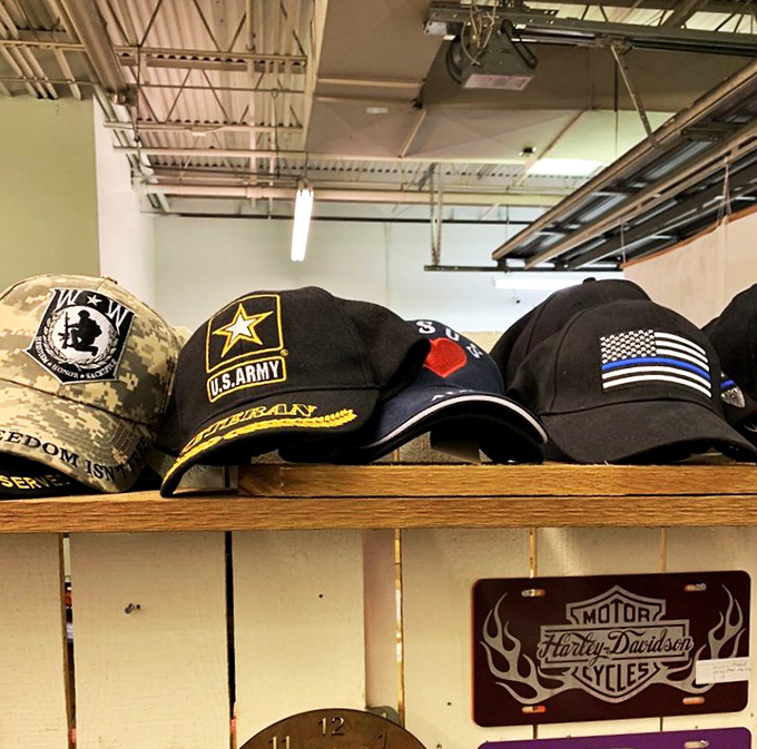 Military caps and Harley-Davidson memorabilia share shelf space in a perfect snapshot of Americana that speaks to both service and freedom.