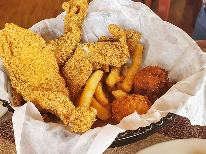 Golden-fried catfish that crunches like autumn leaves. Paired with fries and hushpuppies, it's Southern comfort in a basket.