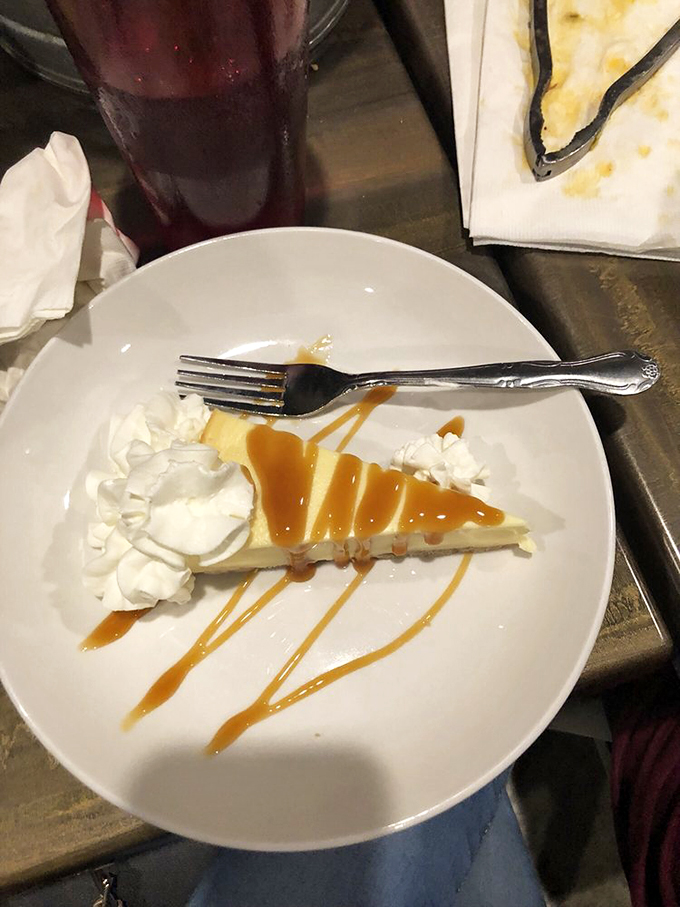 This isn't just cheesecake&mdash;it's the final act in your seafood symphony, with caramel drizzle conducting a sweet farewell to your taste buds.