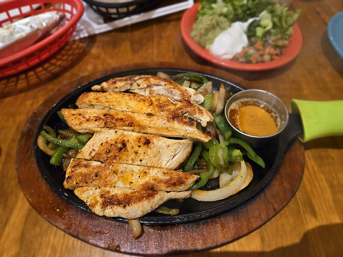 These sizzling chicken fajitas aren't just a meal&mdash;they're dinner theater. The peppers and onions play supporting roles in this sensory blockbuster.