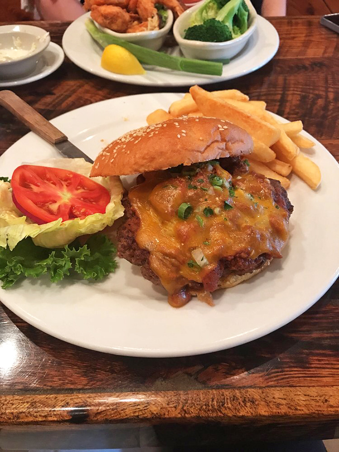 Not all heroes wear capes—some come on sesame seed buns with melted cheese. This burger doesn't just satisfy hunger—it conquers it.