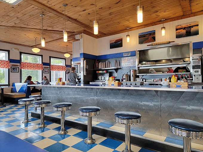 Classic diner counter seating where strangers become friends over coffee and pie—Norman Rockwell would've added this to his collection.