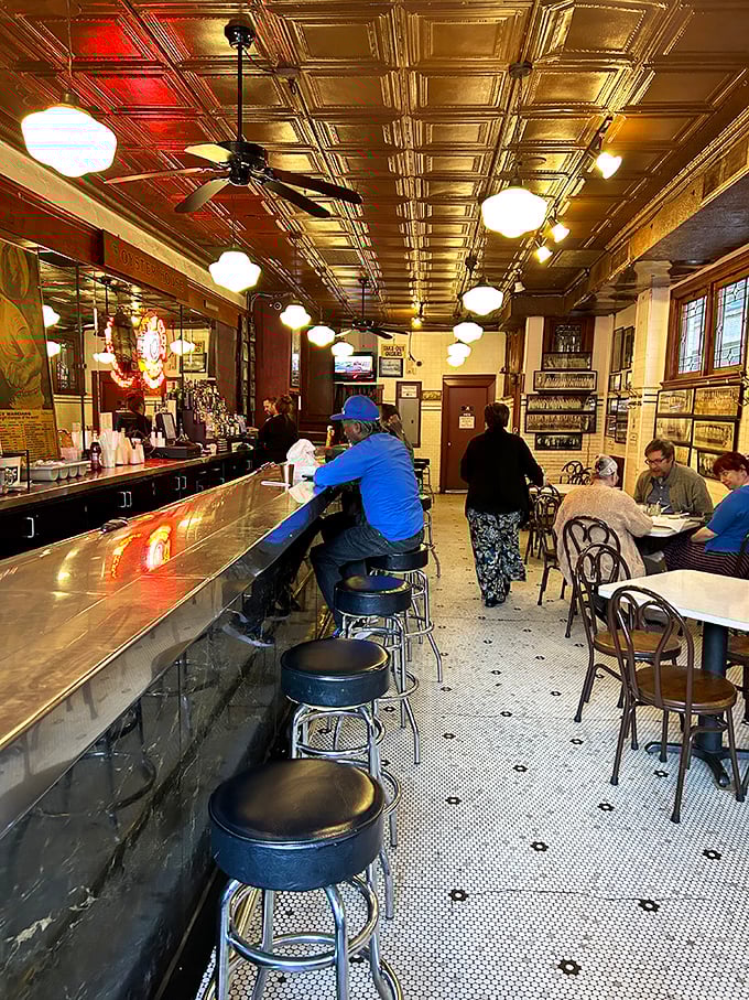 Where strangers become friends over fried fish. The counter seating offers front-row tickets to the culinary show that's been running for decades.