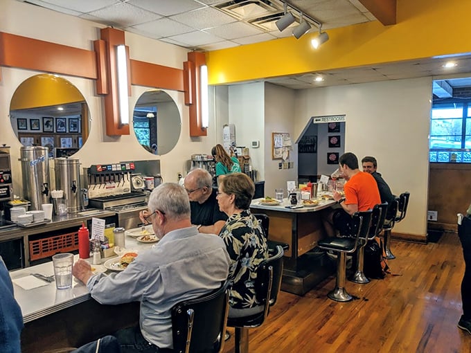 The counter seats offer front-row tickets to the breakfast ballet, where coffee cups are always full and conversation flows freely.