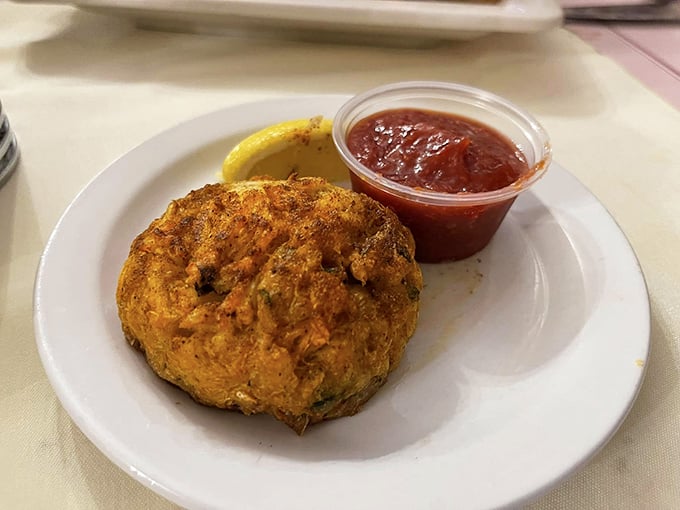 This crab cake isn't just visiting Arkansas from the coast&mdash;it's made itself right at home, golden-brown and ready for its cocktail sauce companion.