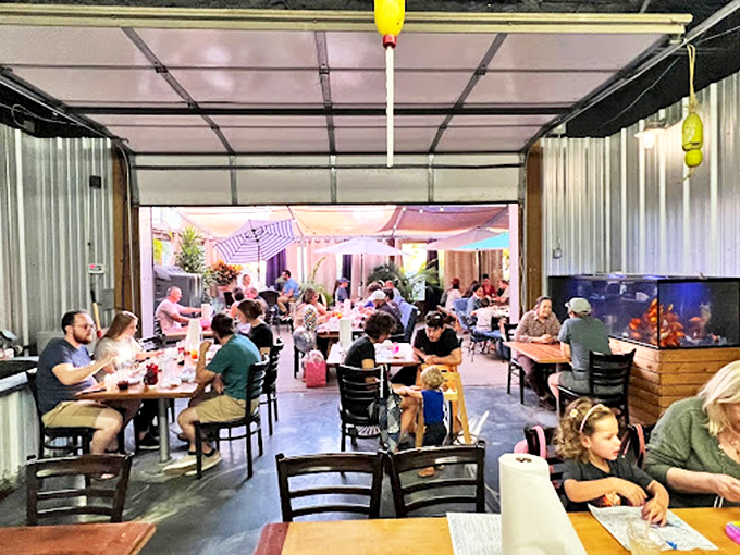 The covered patio buzzes with happy diners enjoying their oceanic treasures. This communal space transforms meals into social occasions where food becomes the centerpiece of connection.