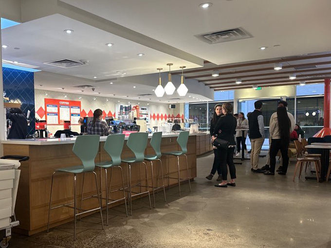The evening crowd gathers at the altar of fried dough. Notice the anticipation in their stance&mdash;that's the universal body language for "about to experience joy."