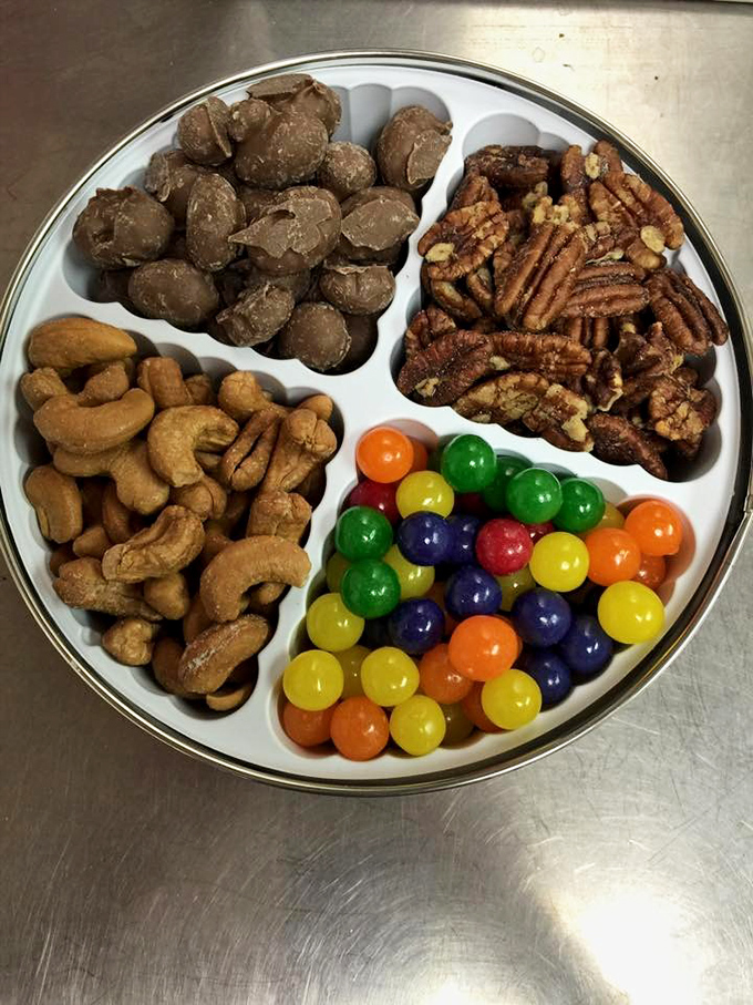 The perfect gift tin: a diplomatic arrangement of nuts, chocolates, and candies that ensures family peace during holiday gatherings.