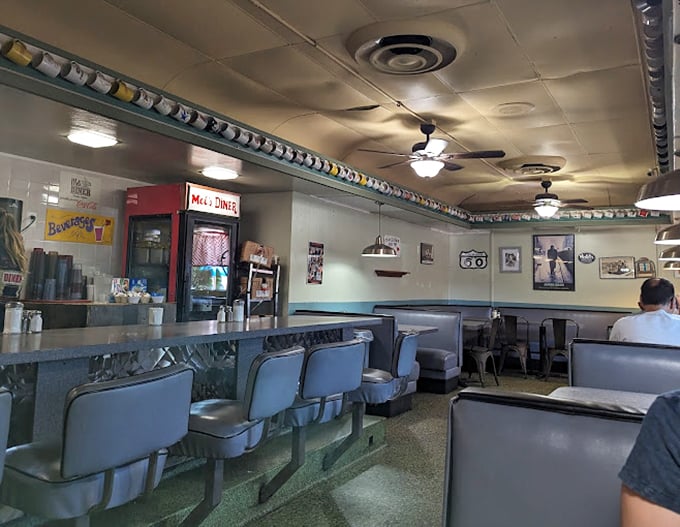 The interior design philosophy at Mel's: keep it classic, comfortable, and unpretentious. These booths have heard decades of conversations, confessions, and corny jokes.