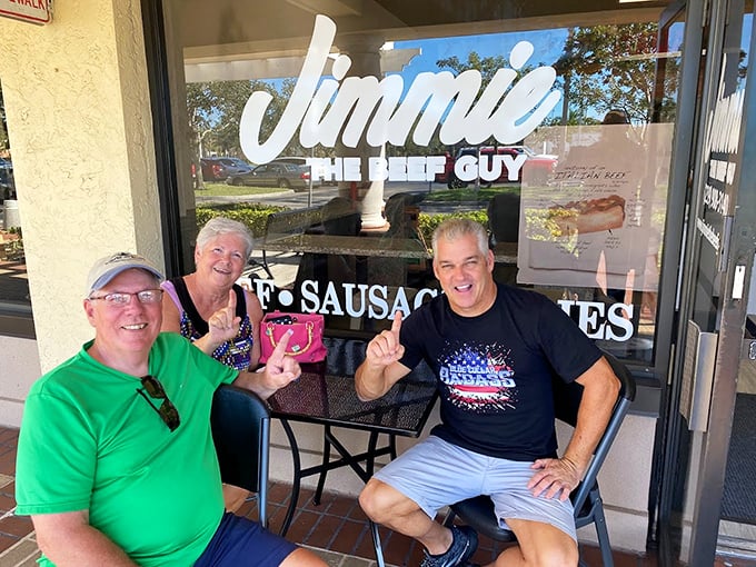 Happy customers giving the universal sign of sandwich approval. When food makes you smile like this, you know you've found something special.