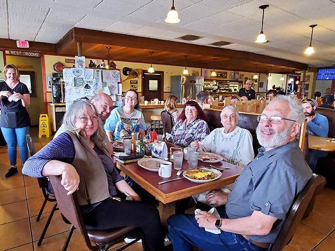 Where strangers become friends over shared appreciation of good food. These smiles aren't just for the camera—they're for the incoming plates.