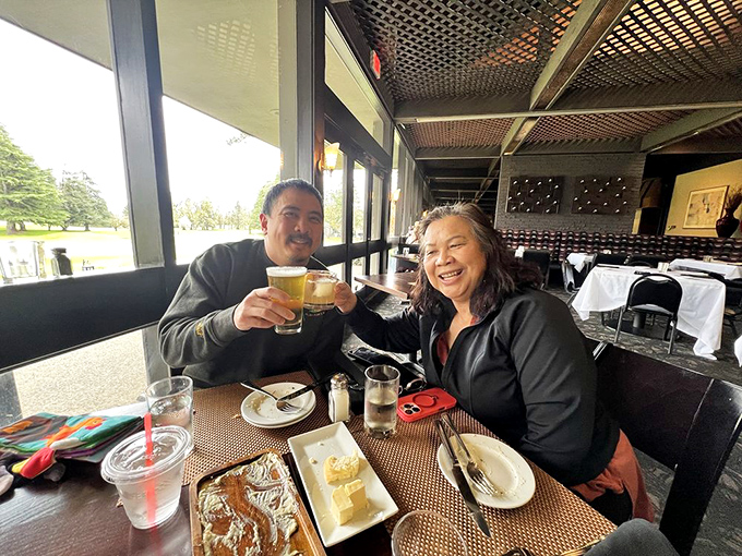Happy diners toasting to good food and better company. This is what restaurants are really about &ndash; human connection over shared pleasure.