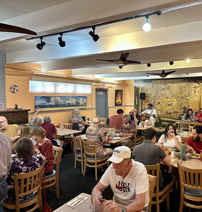 The dining room hums with the universal language of satisfaction&mdash;forks diving, conversations flowing, and not a cell phone in sight.