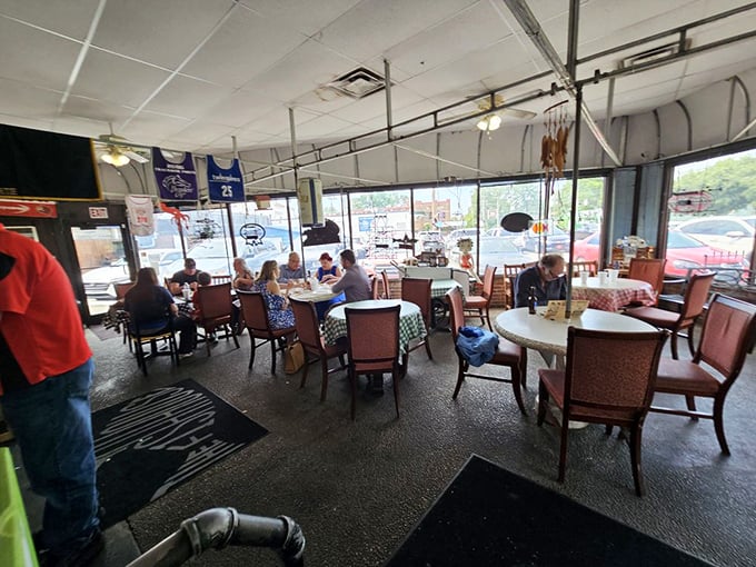 The dining room buzzes with satisfied customers. Every table tells a story of seafood satisfaction.