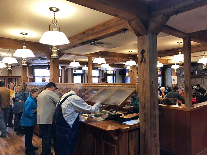 The buffet line tells the story of American dining&mdash;where strangers become neighbors over shared tongs and the mutual pursuit of second helpings.