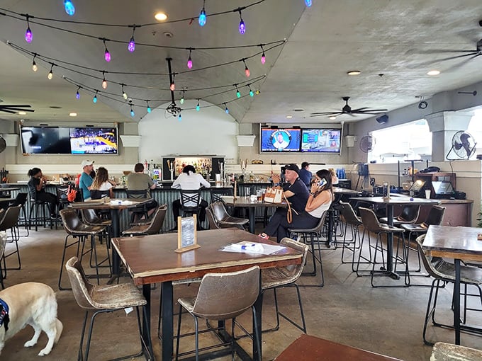 Where strangers become friends over shared glances that say, "Are you seeing the size of that burger too?" String lights add that touch of magic.