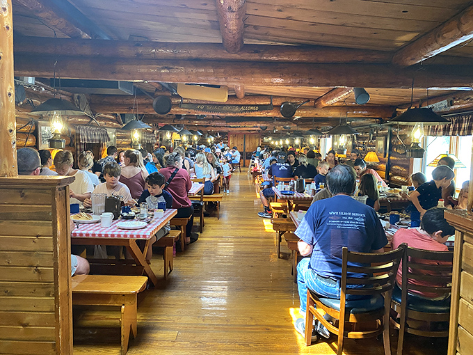 A packed house of satisfied customers proves the universal truth: when faced with all-you-can-eat breakfast in a log cabin, resistance is futile.