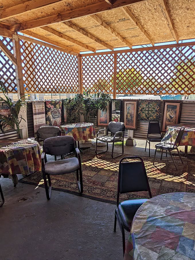 The patio dining area feels like someone's backyard &ndash; where mismatched furniture and patchwork tablecloths create unexpected magic.