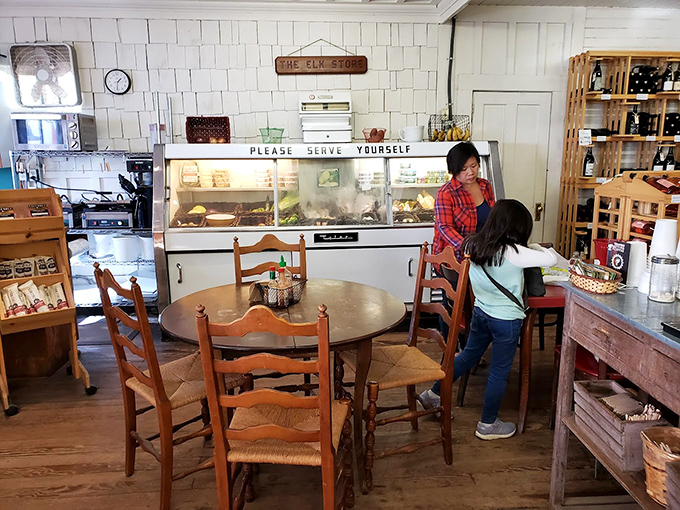 The dining area offers a moment of respite for weary travelers. That "Please Serve Yourself" sign might be the most welcoming phrase in the English language.