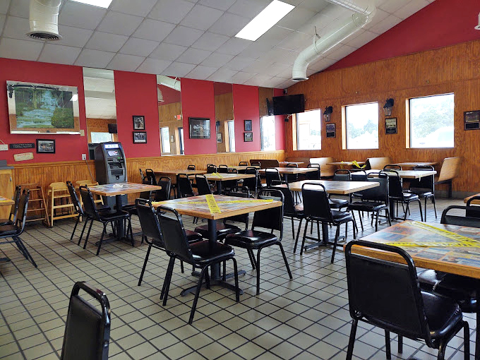 Where simplicity reigns supreme. Red walls, wood paneling, and tables that have heard decades of satisfaction expressed through happy sighs.