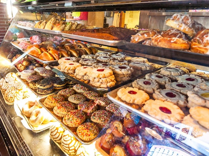 This pastry case isn't just displaying food&mdash;it's showcasing edible art. Each cookie, concha, and empanada represents generations of baking tradition.