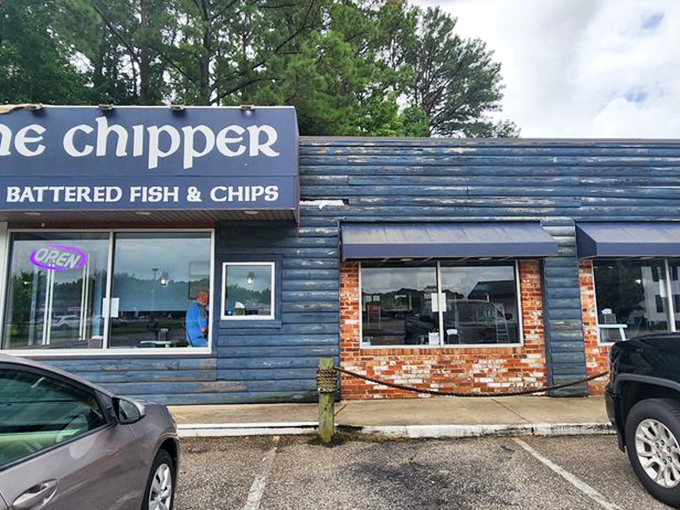 The blue clapboard exterior with exposed brick accents gives The Chipper that perfect blend of coastal charm and no-nonsense British pragmatism.