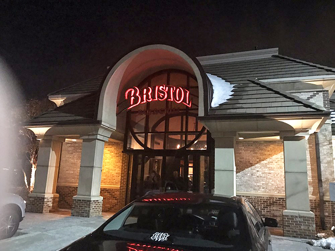 As night falls, Bristol's entrance transforms into a warm glow of possibility&mdash;where seafood dreams come true despite being hundreds of miles from any coast.