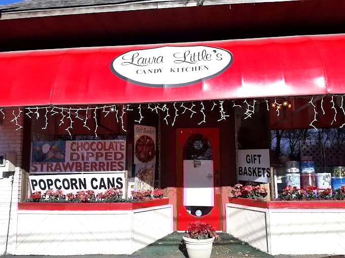 Christmas lights twinkle above bold window signs announcing treasures within&mdash;like chocolate-dipped strawberries that make roses seem unimaginative.