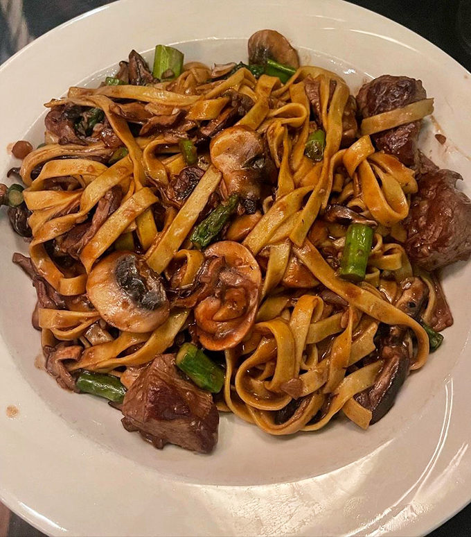 Pasta that doesn't need a passport to transport you - ribbons of fettuccine dancing with mushrooms, asparagus and perfectly cooked steak.