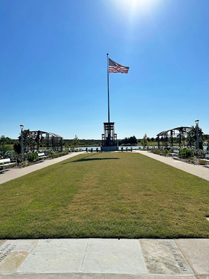 This patriotic garden space offers a moment of reflection, where carefully designed symmetry creates a sense of order amid nature's beautiful chaos.